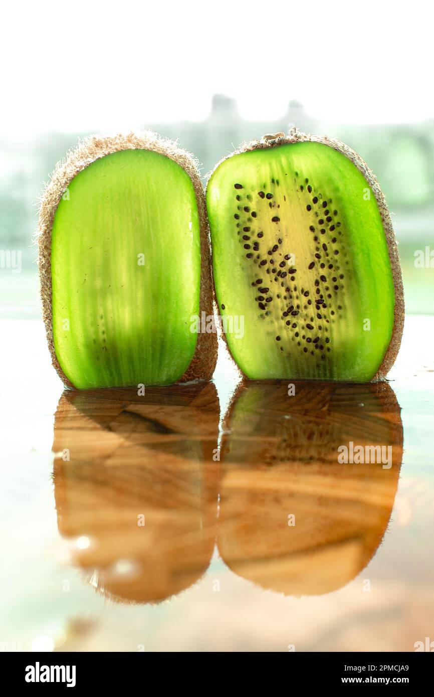 Close-up of a kiwi fruit with its vibrant green color. The texture ...
