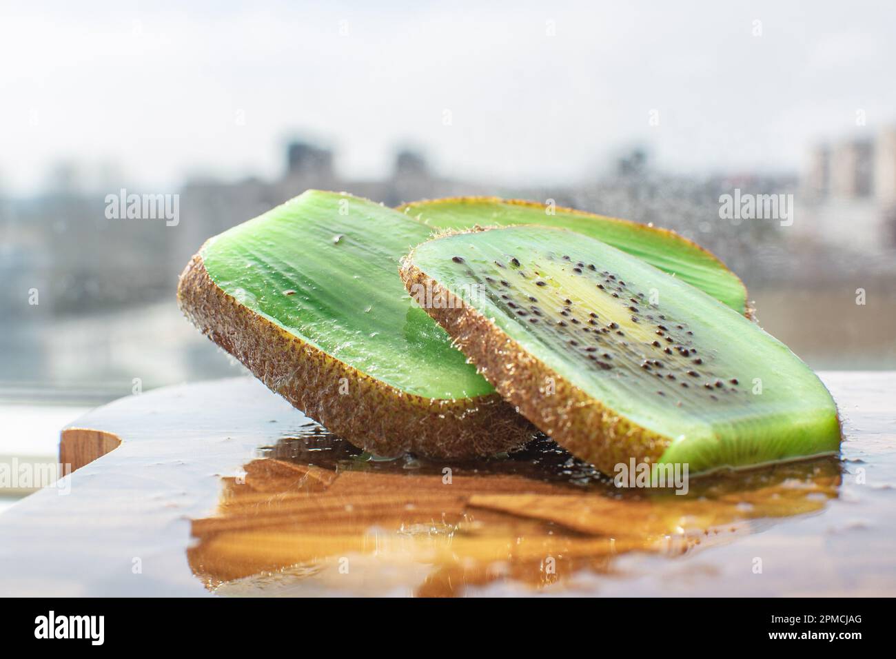 Close-up of a kiwi fruit with its vibrant green color. The texture ...