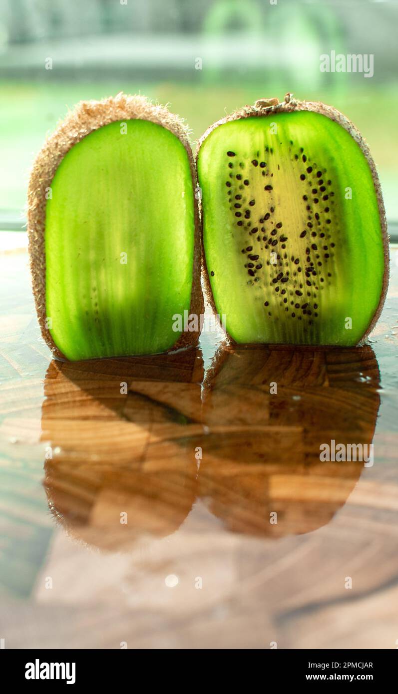 Close-up of a kiwi fruit with its vibrant green color. The texture ...