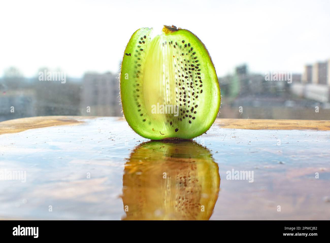 Close-up of a kiwi fruit with its vibrant green color. The texture ...