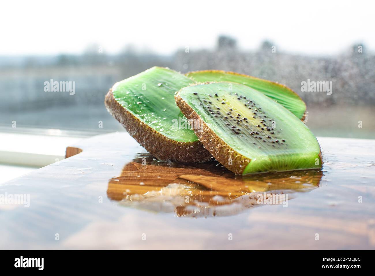 Close-up of a kiwi fruit with its vibrant green color. The texture ...