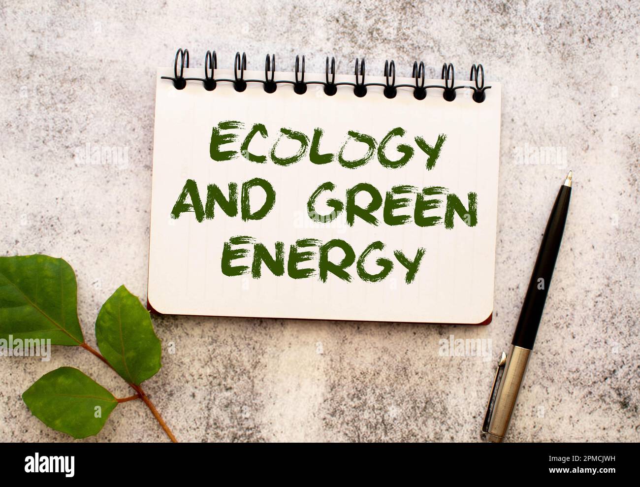 Between two sheets from a notebook on a green strip with the ...