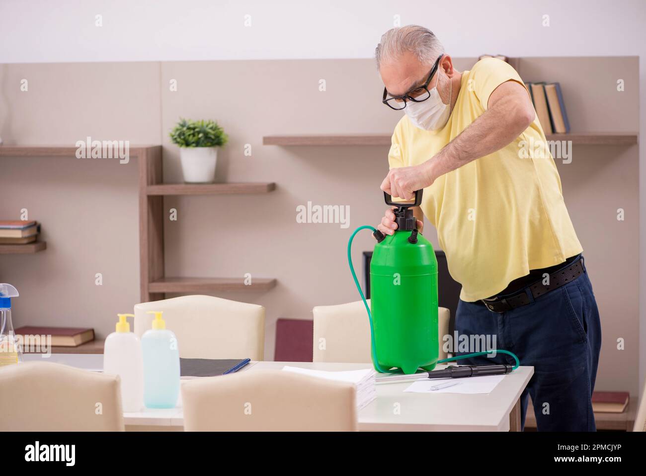 Old man cleaning the house Stock Photo - Alamy