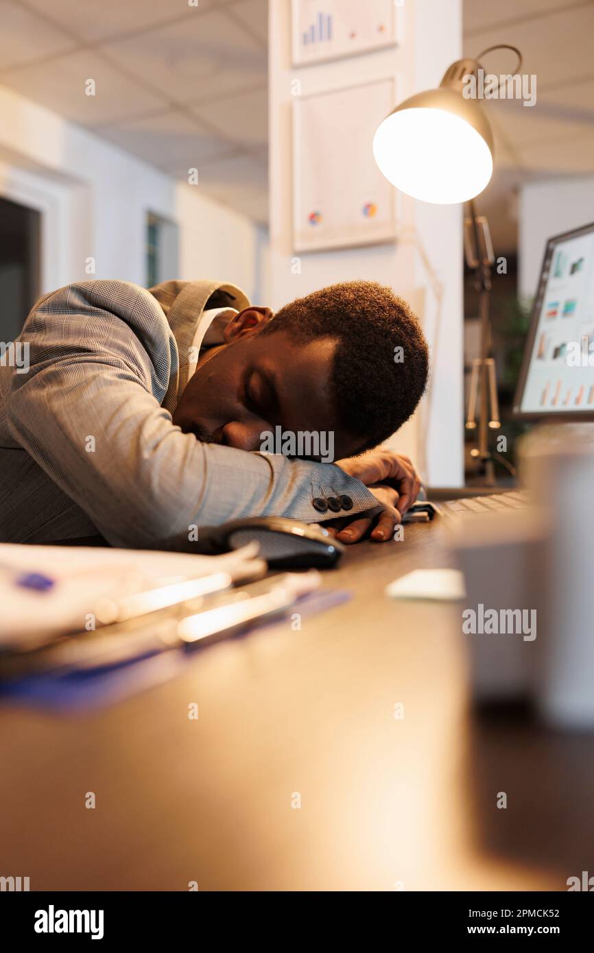 Exhausted employee with burnout syndrome resting at work after ...