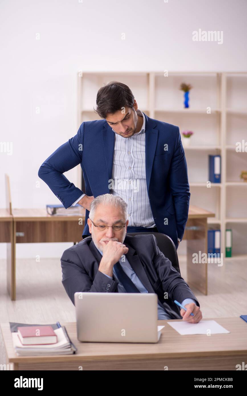 Two colleagues working in the office Stock Photo - Alamy
