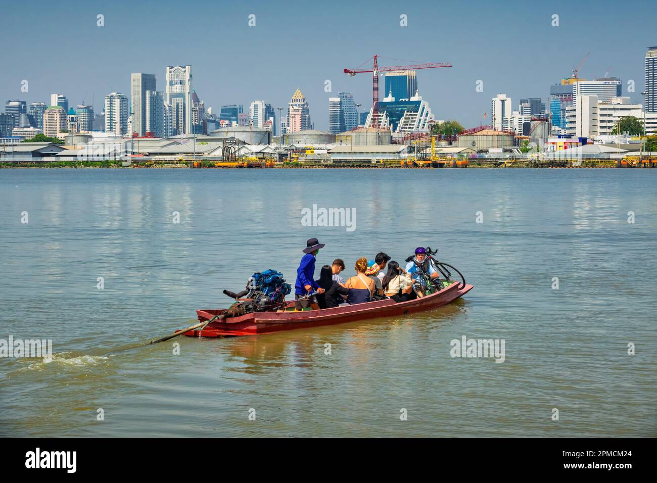 Boat transporting people over the Chao Phraya River in Bangkok ...