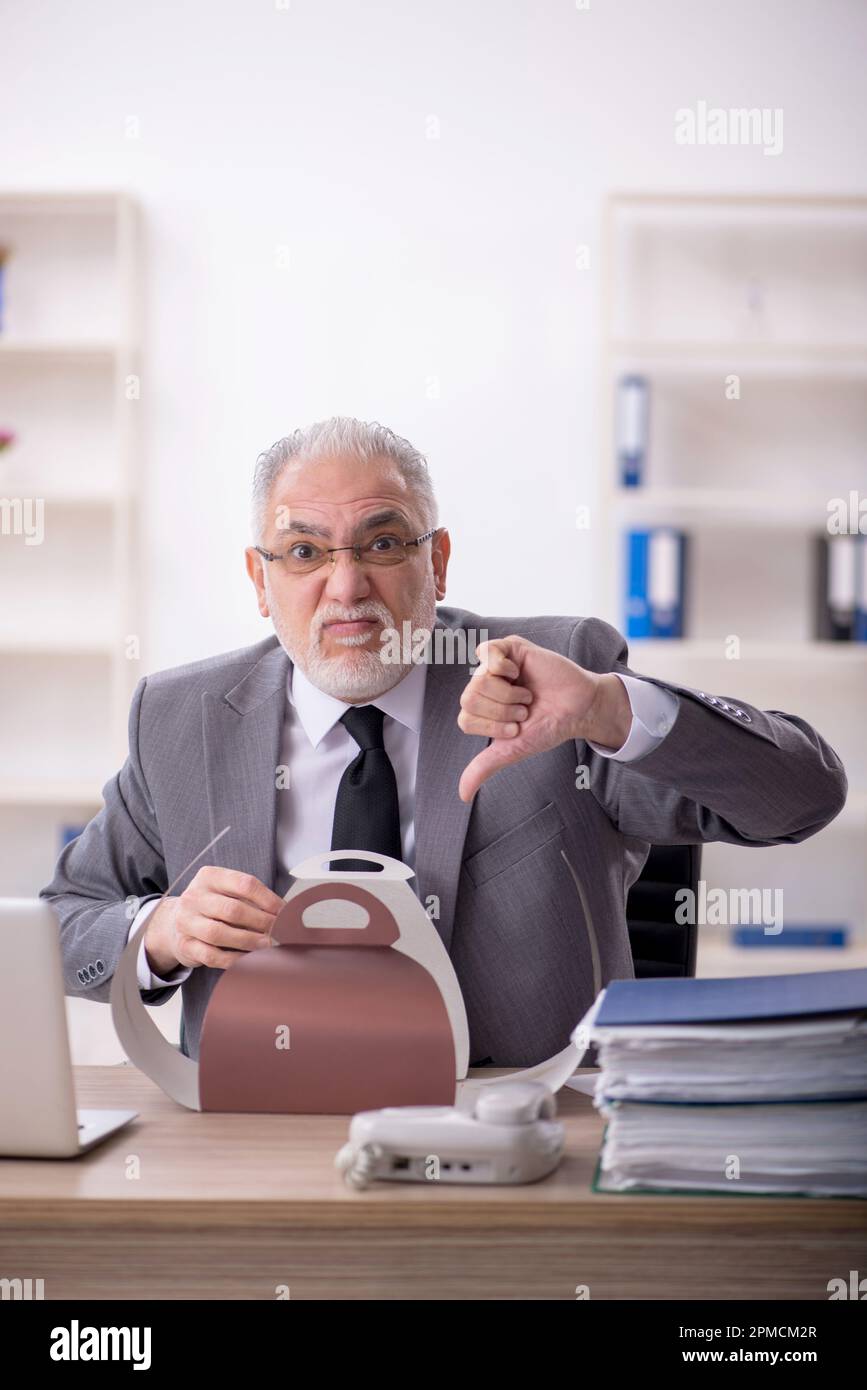 Happy businessman receiving birthday cake hi-res stock photography and ...