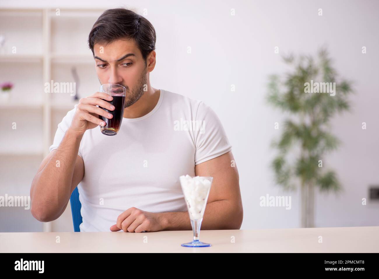 Young student testing soft drink Stock Photo - Alamy