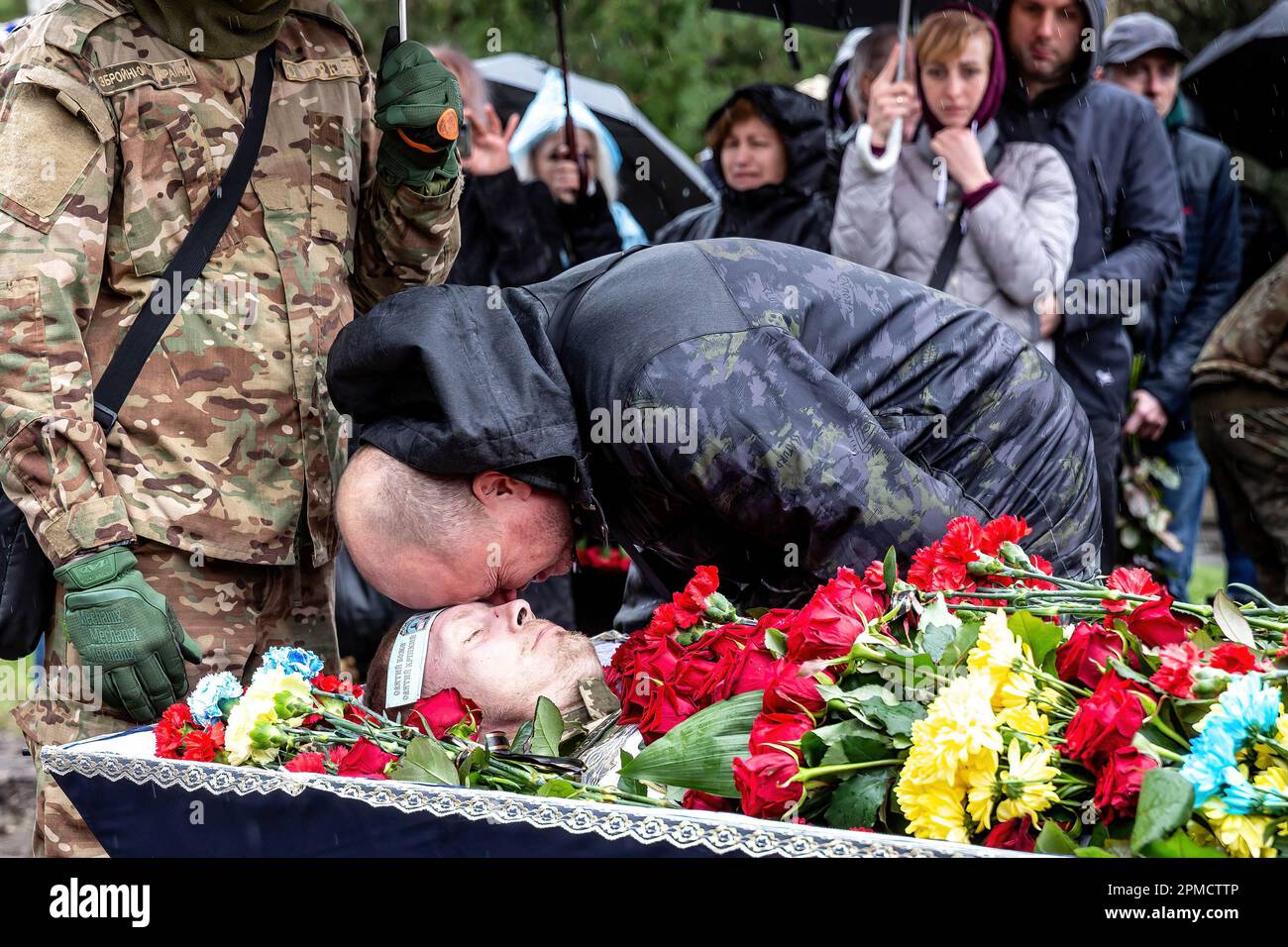 (EDITORS NOTE: Image depicts death) A friend pays respect during a ...