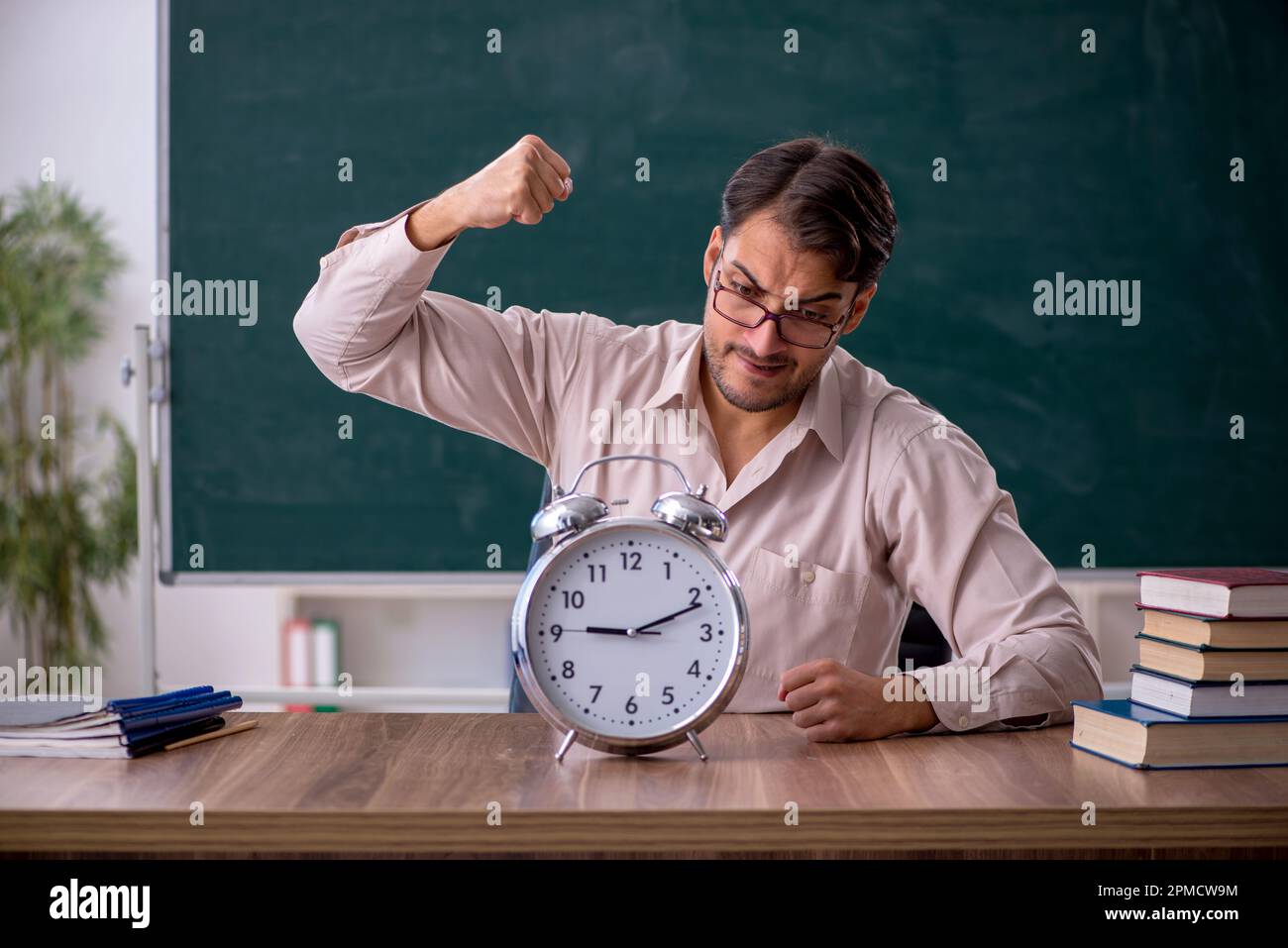 Angry teacher hitting student hi-res stock photography and images - Alamy