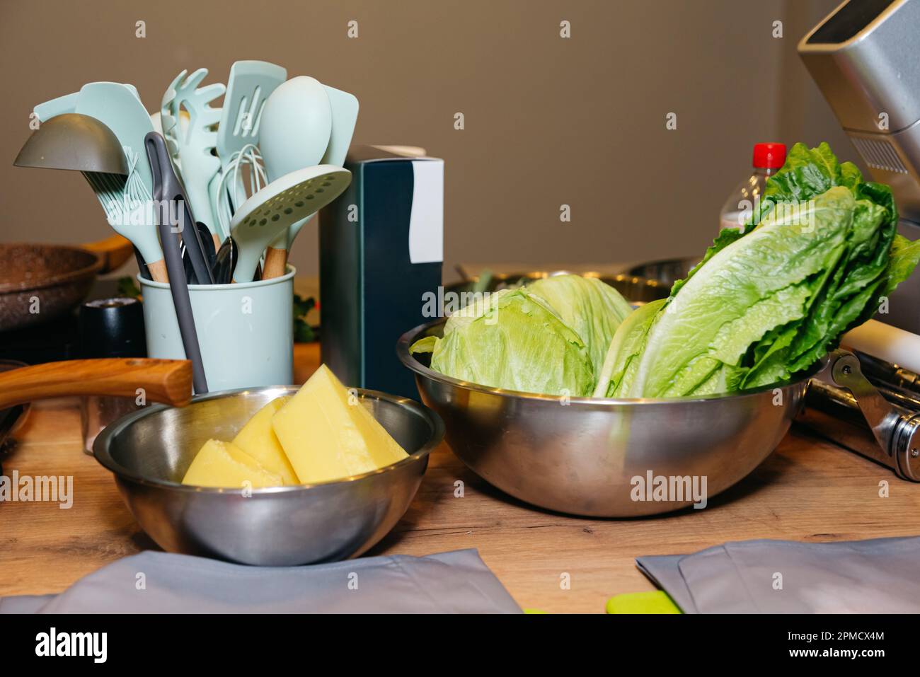 cabbage lettuce in a metal bowl on a wooden table in a kitchen. Big ...