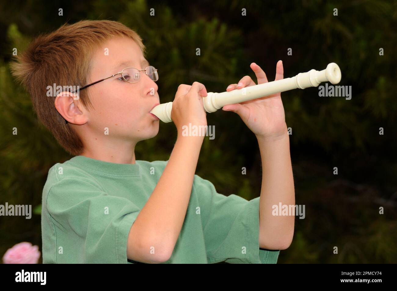 Young boy playing a recorder musical instrument Stock Photo - Alamy