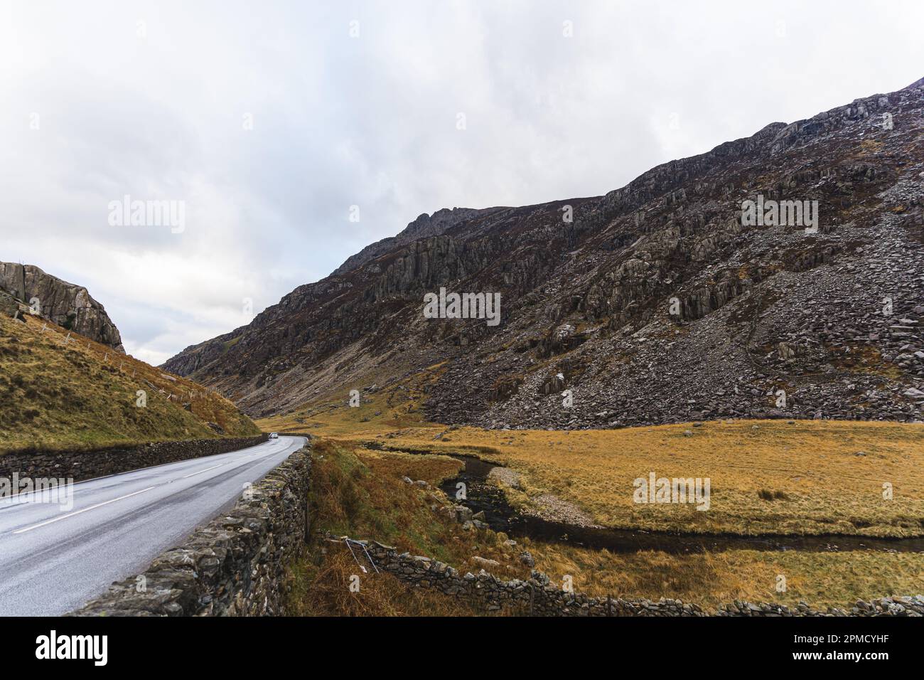 Open road leading through Snowdonia mountain national park in North ...