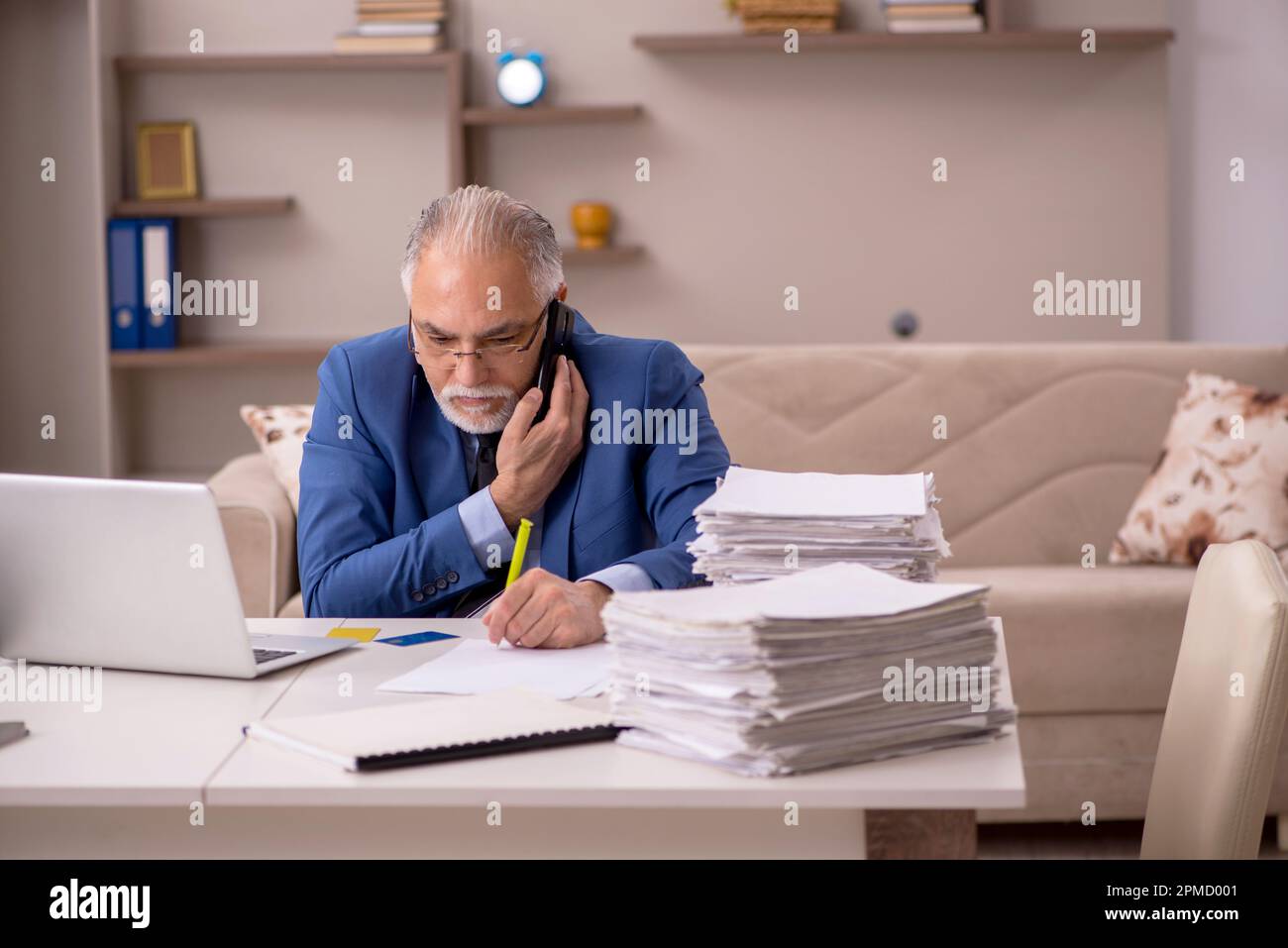 Old boss working from home during pandemic Stock Photo - Alamy