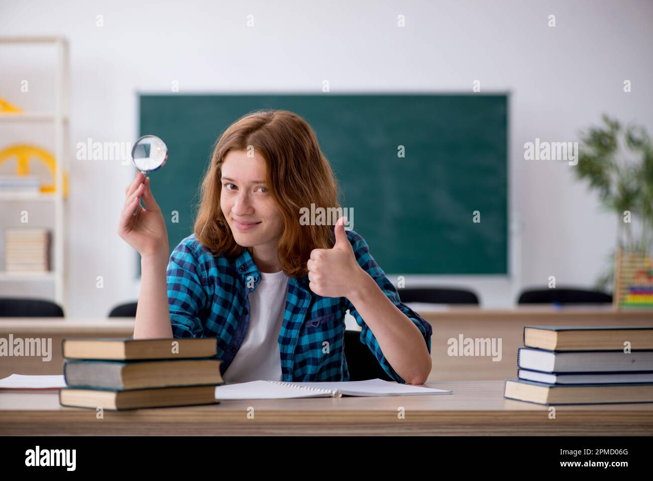 Female student preparing for exams in the classroom Stock Photo - Alamy