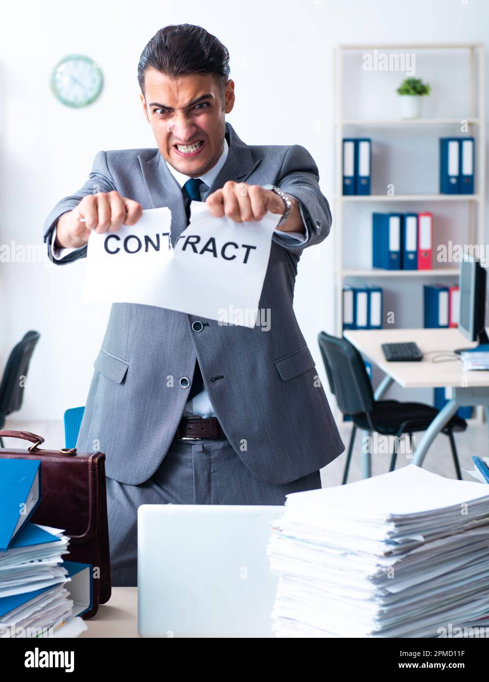 The businessman with heavy paperwork workload Stock Photo - Alamy