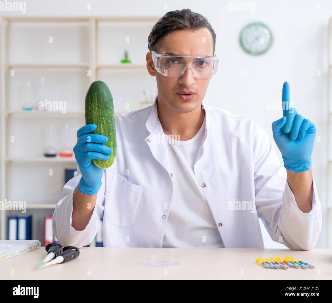 The male nutrition expert testing vegetables in lab Stock Photo - Alamy