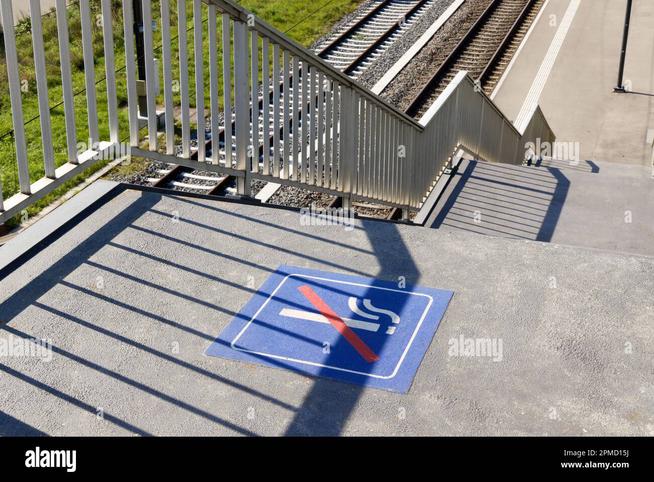 train station. no smoking sign in front of station stairs. view of the ...