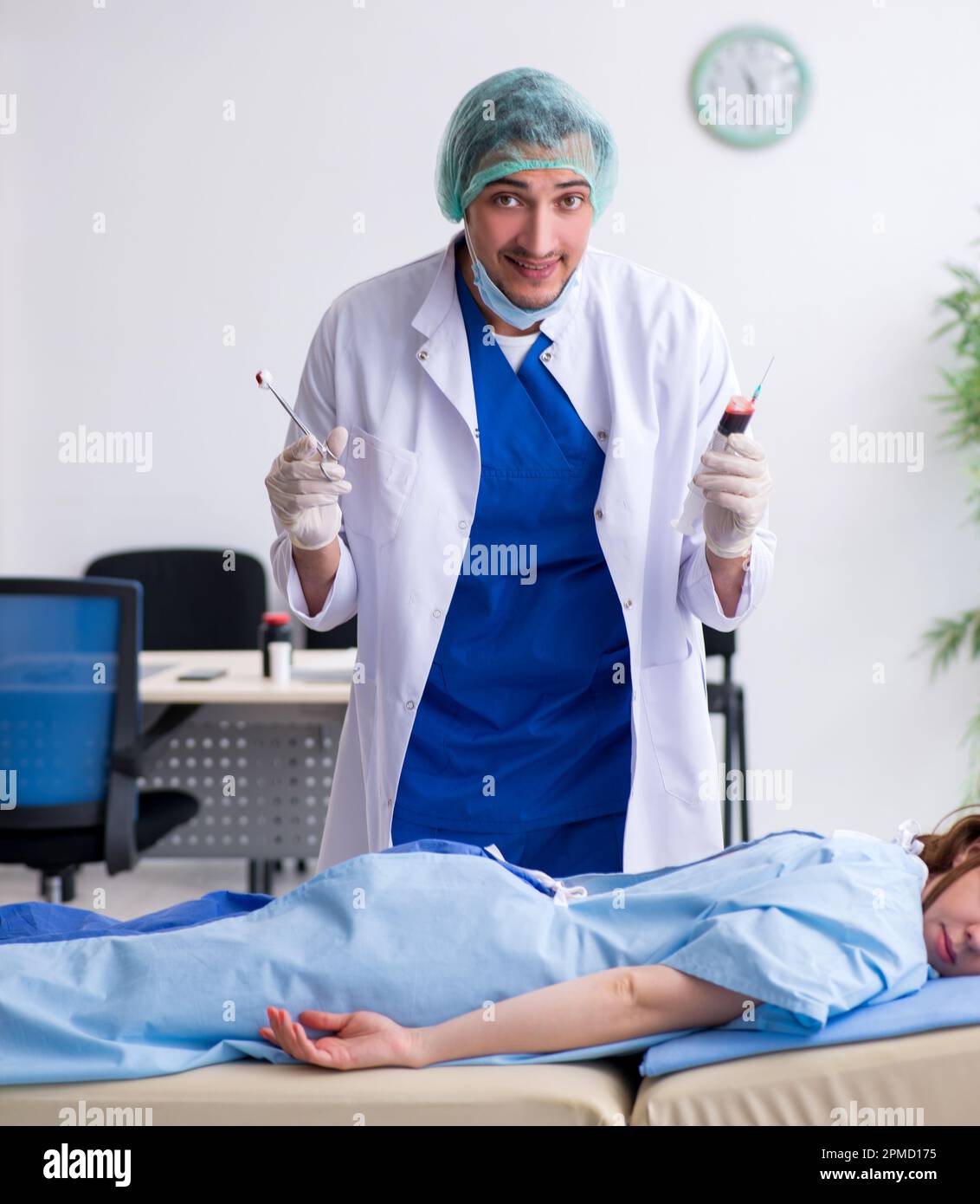 The female patient getting an injection in the clinic Stock Photo - Alamy