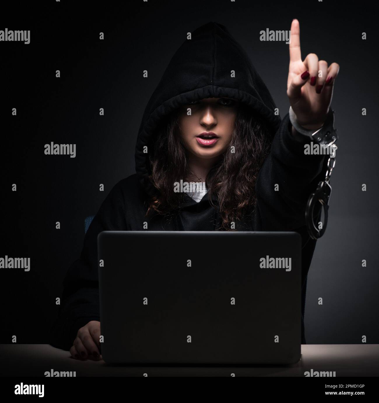The female hacker hacking security firewall late in office Stock Photo ...