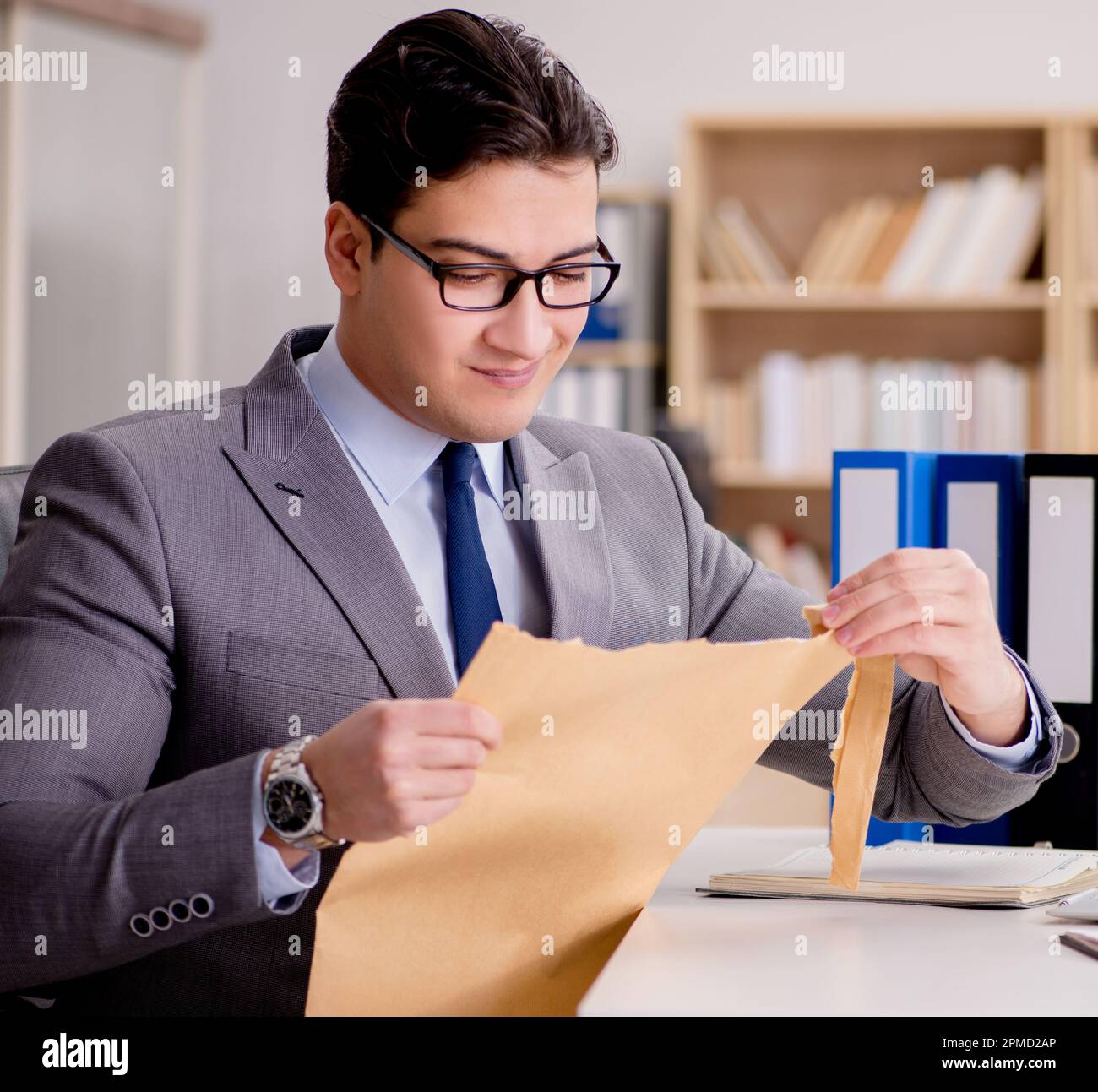 The businessman receiving letter envelope in office Stock Photo - Alamy