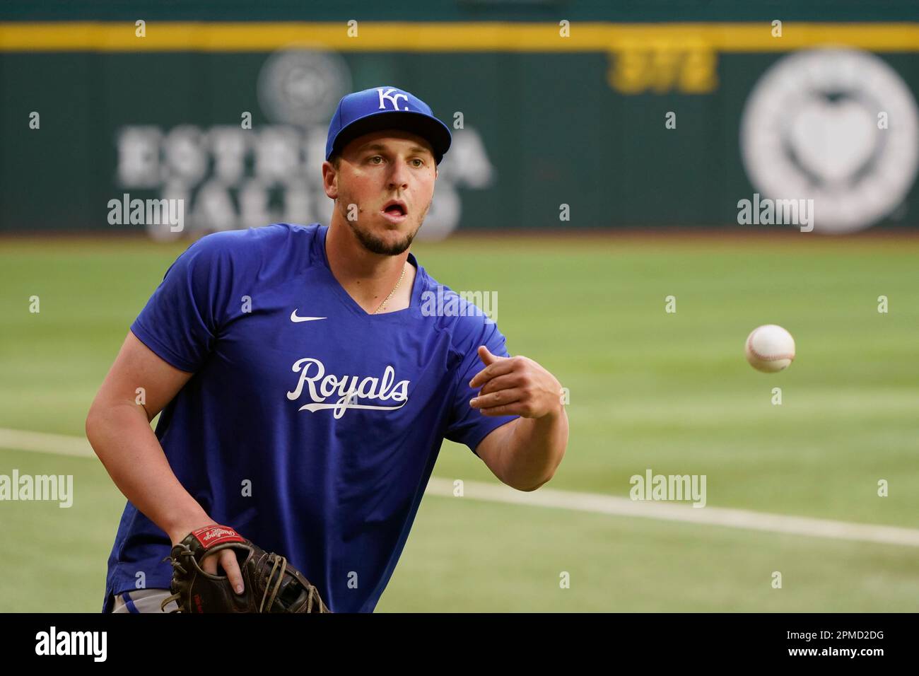 Kansas City Royals infielder Vinnie Pasquantino tosses a ball during ...