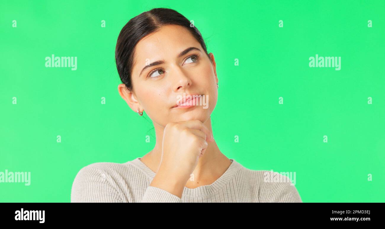 Face, idea and option with a woman on a green screen background in ...