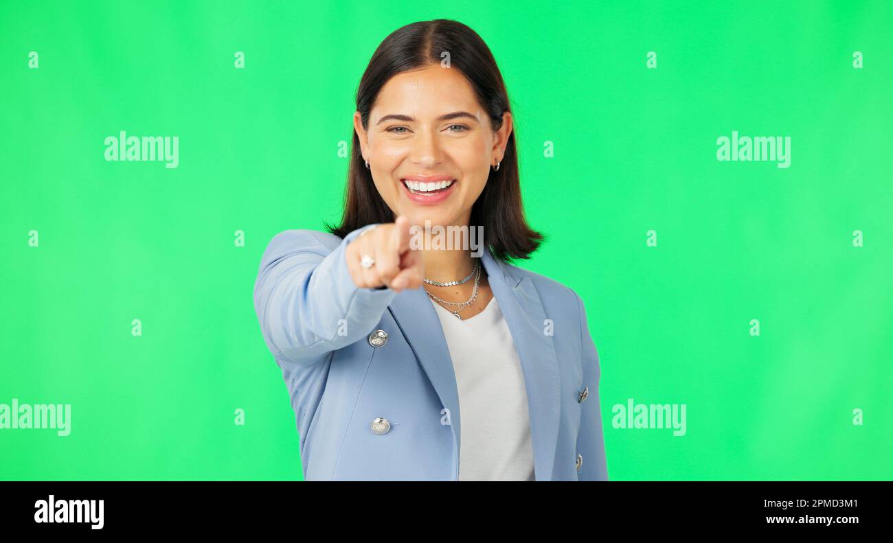 Business woman, face and point at you by green screen with smile for ...