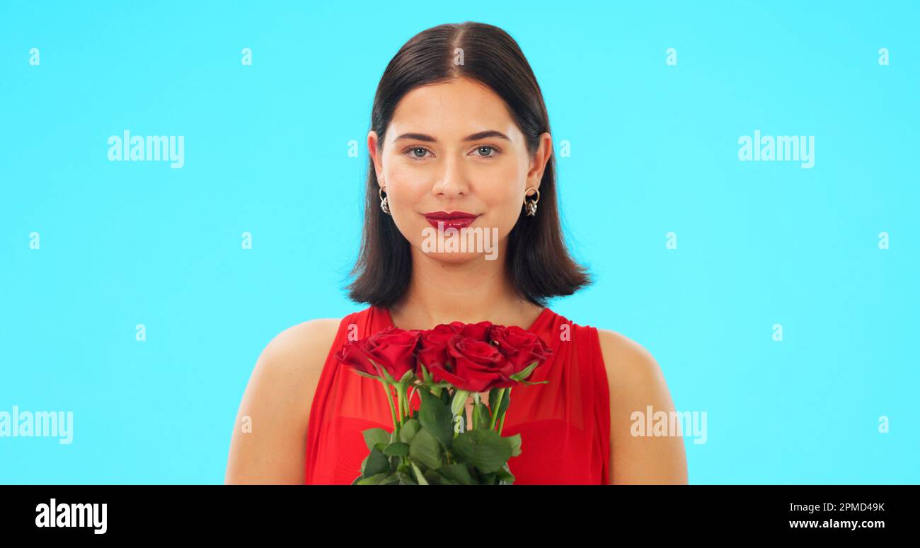 Bouquet of flowers, happy woman and face in studio, blue background and ...