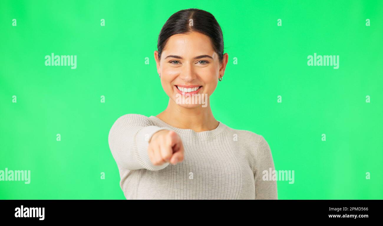 Face, pointing to you and woman with green screen, inspiration and smile on studio background ...