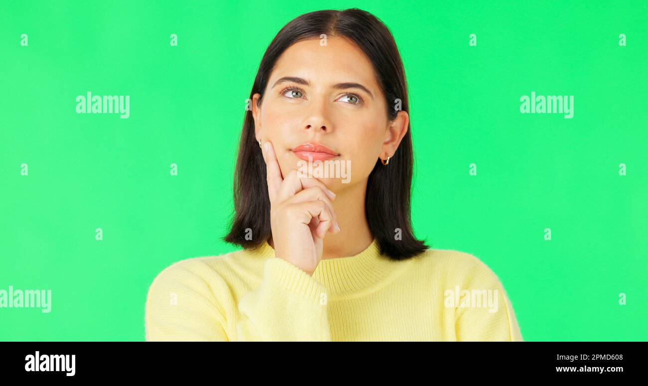 Face, thinking and consider with a woman on a green screen background ...