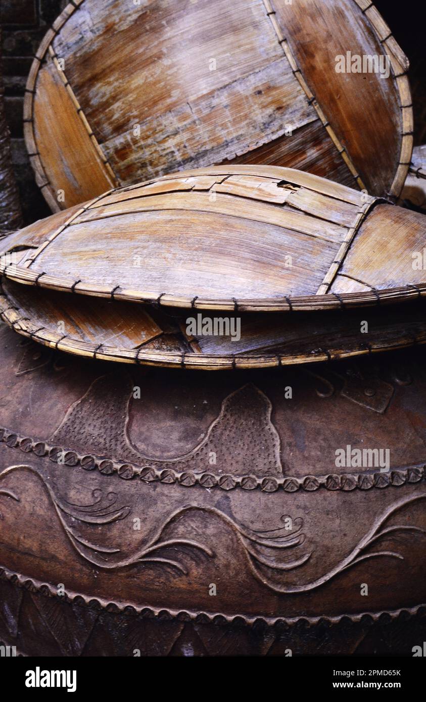 Balinese Terra Cotta Clay Pot with woven lids Stock Photo - Alamy