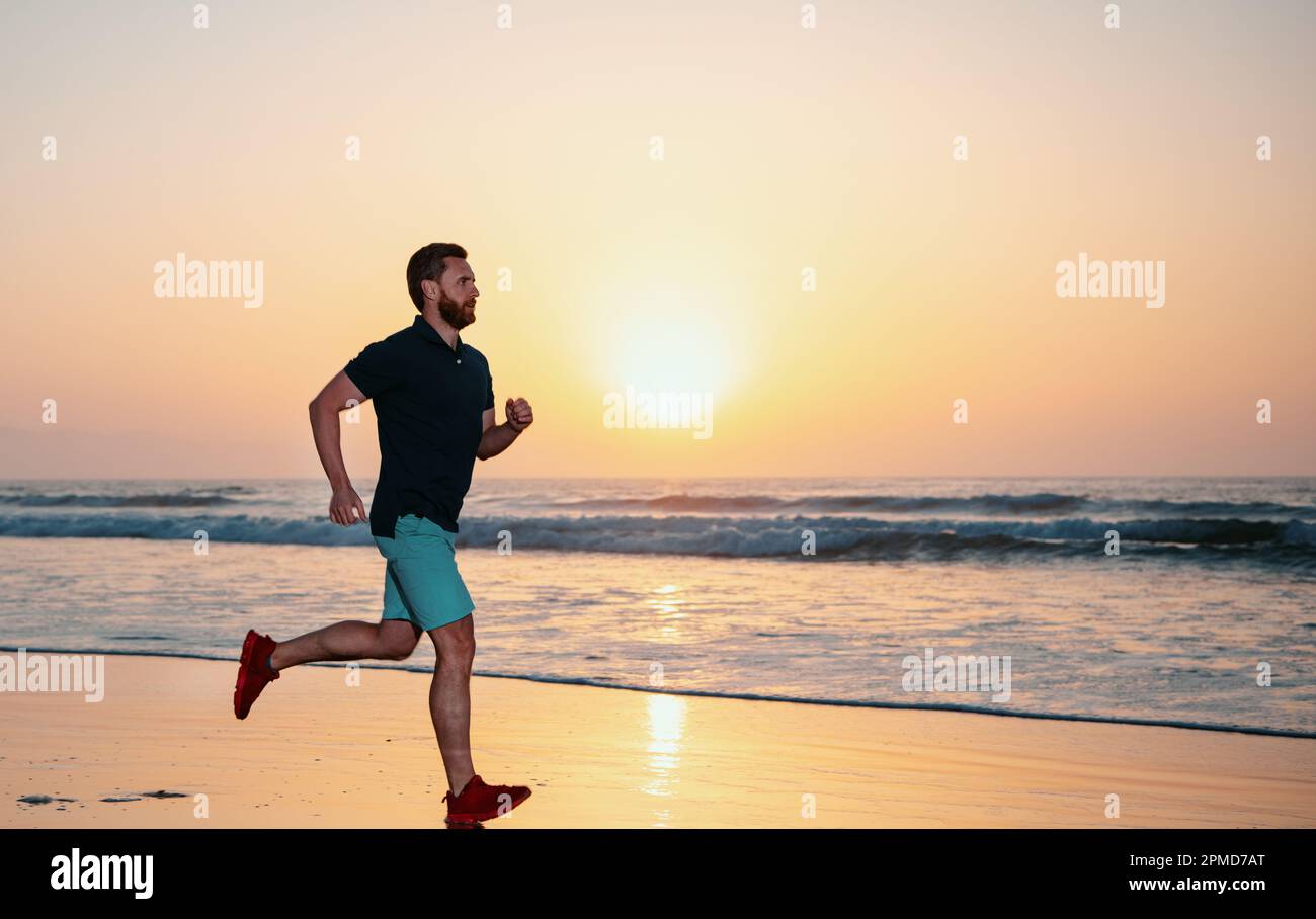 Full length of healthy man running and sprinting outdoors. Male runner ...