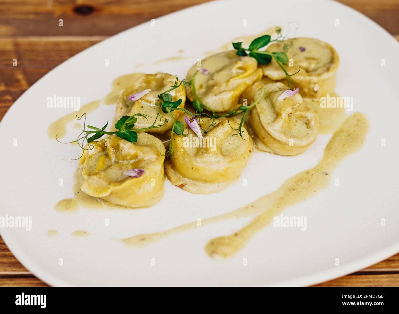 In this photo, we see a plate of homemade Italian pasta with a ...