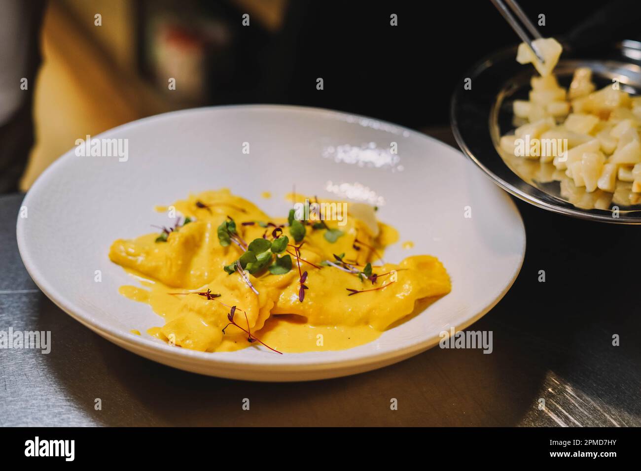 In this photo, we see a plate of homemade Italian pasta with a ...