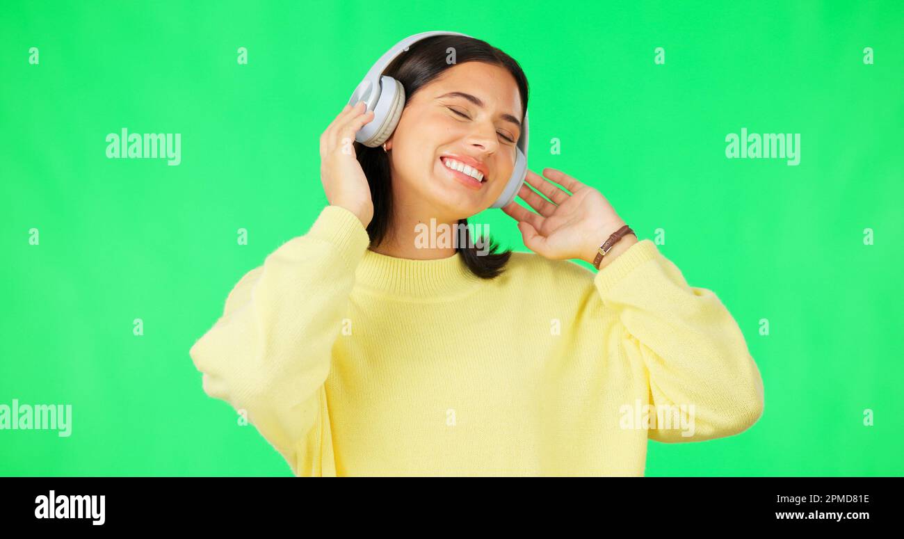 Face, green screen and woman with headphones, listen and movement on a ...