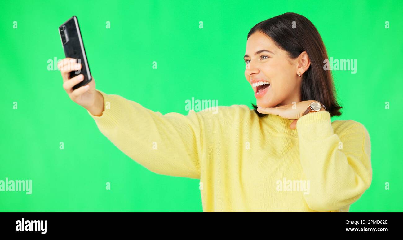 Happy woman, face and selfie on green screen with peace sign and facial ...
