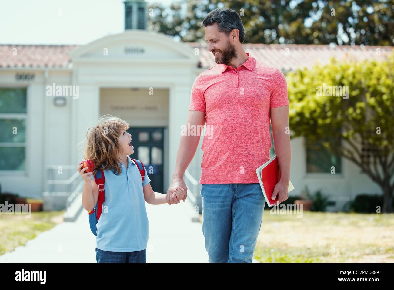 Father and son go to school, education and learning. School, family ...