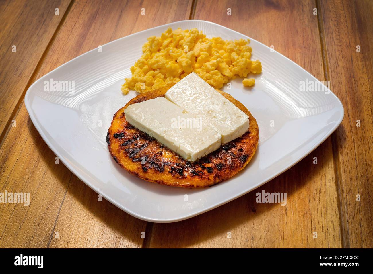 Arepa chocolo with cheese and egg - Traditional Colombian breakfast ...