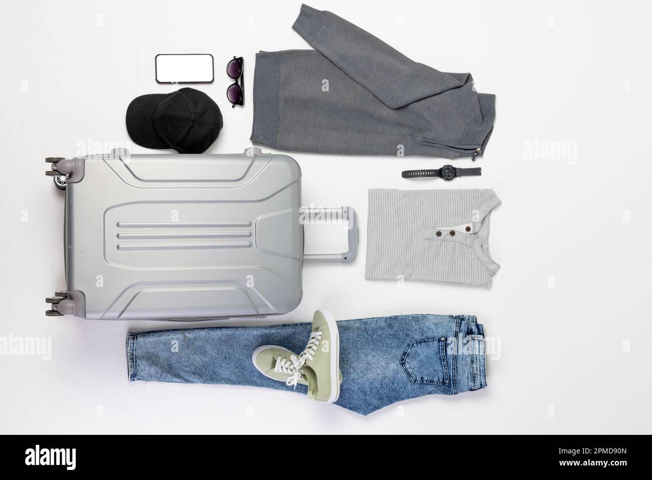 Suitcase, clothes, sunglasses, watch and smartphone with copy space on ...
