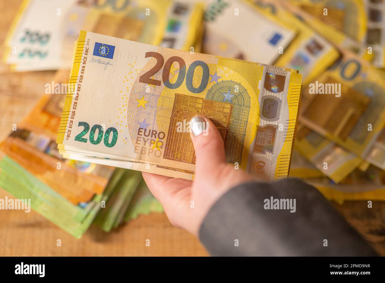 Recalculation of money.200 euro banknotes. Hands recalculate banknotes ...