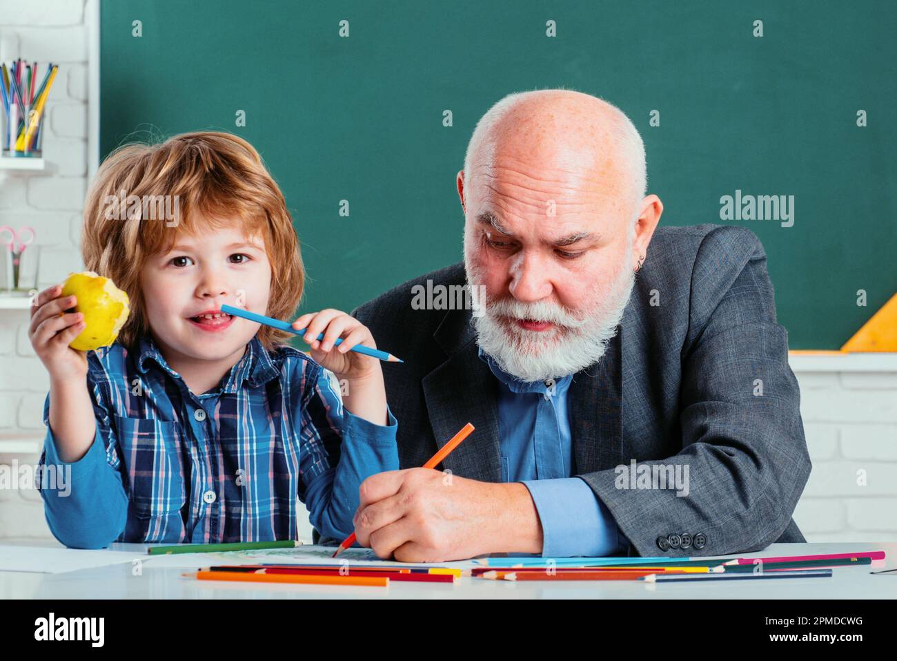 Elderly teach children classroom hi-res stock photography and images ...