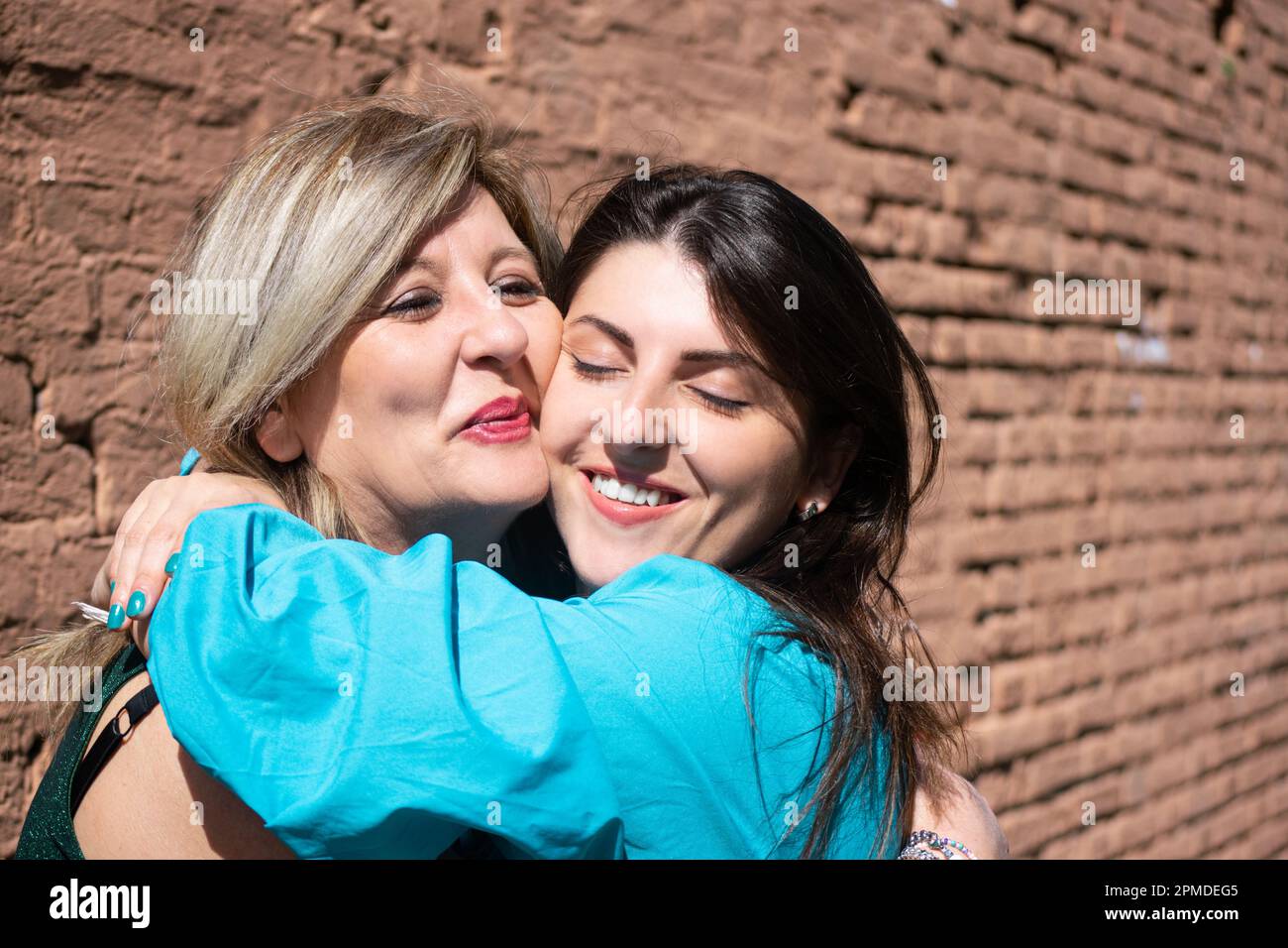 Mother and daughter hugging and expressing affection. Mother's day ...
