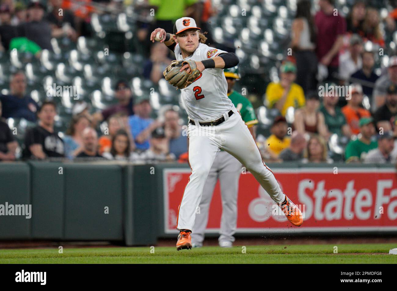 Baltimore Orioles third baseman Gunnar Henderson throws to first base for the out after fielding ...