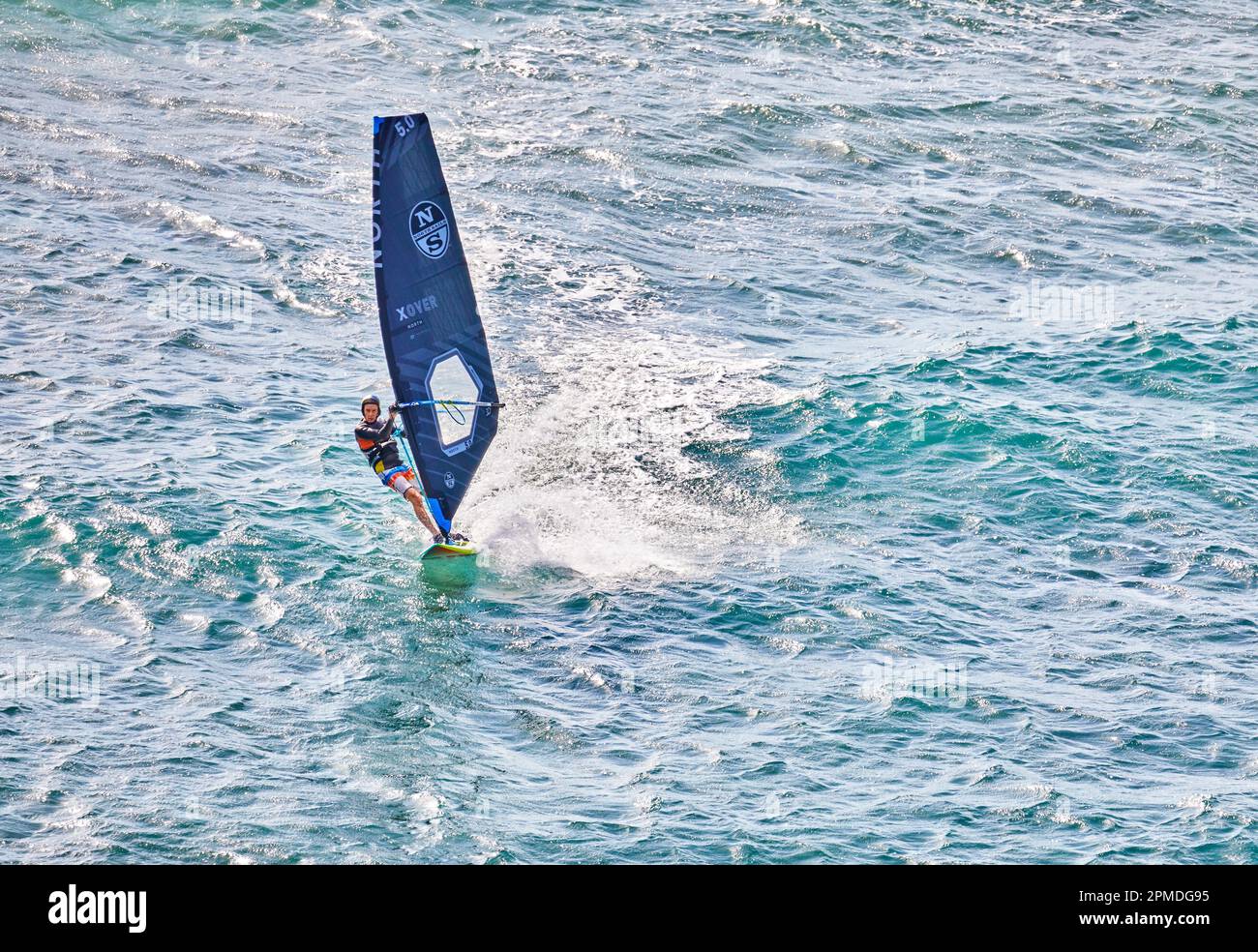 Honolulu, Oahu, Hawaii, USA, - February 6, 2023: A Windsurfer in the ...