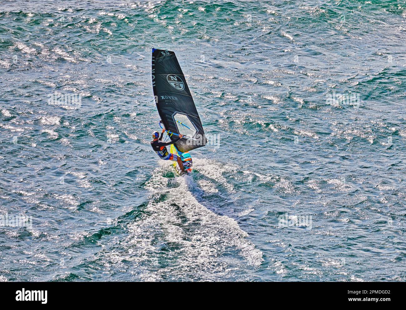 Honolulu, Oahu, Hawaii, USA, - February 6, 2023: A Windsurfer in the ...