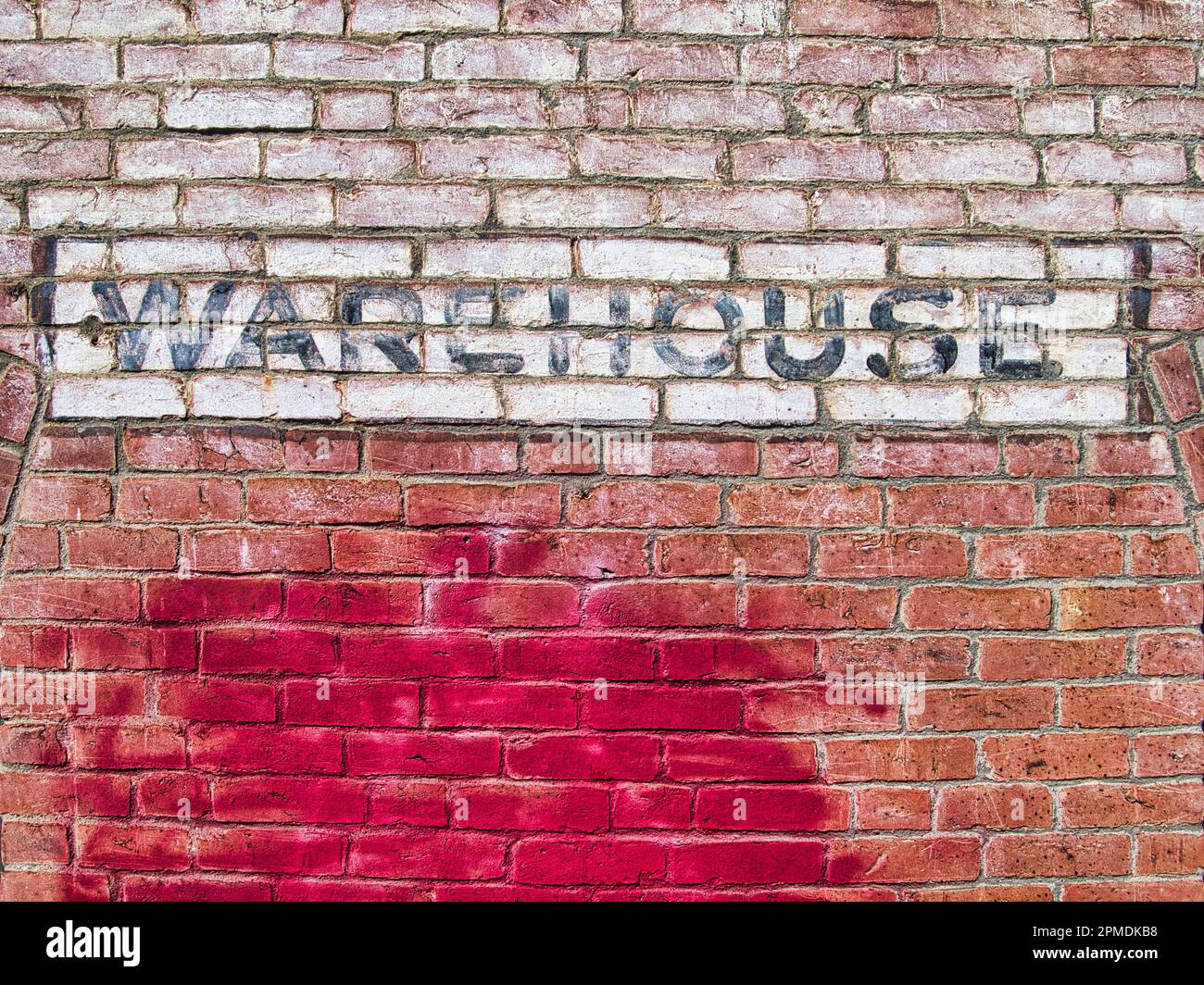 unique old warehouse sign on brick building Stock Photo - Alamy