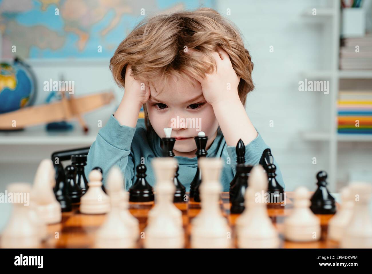 Boy think or plan about chess game, vintage style for education concept ...