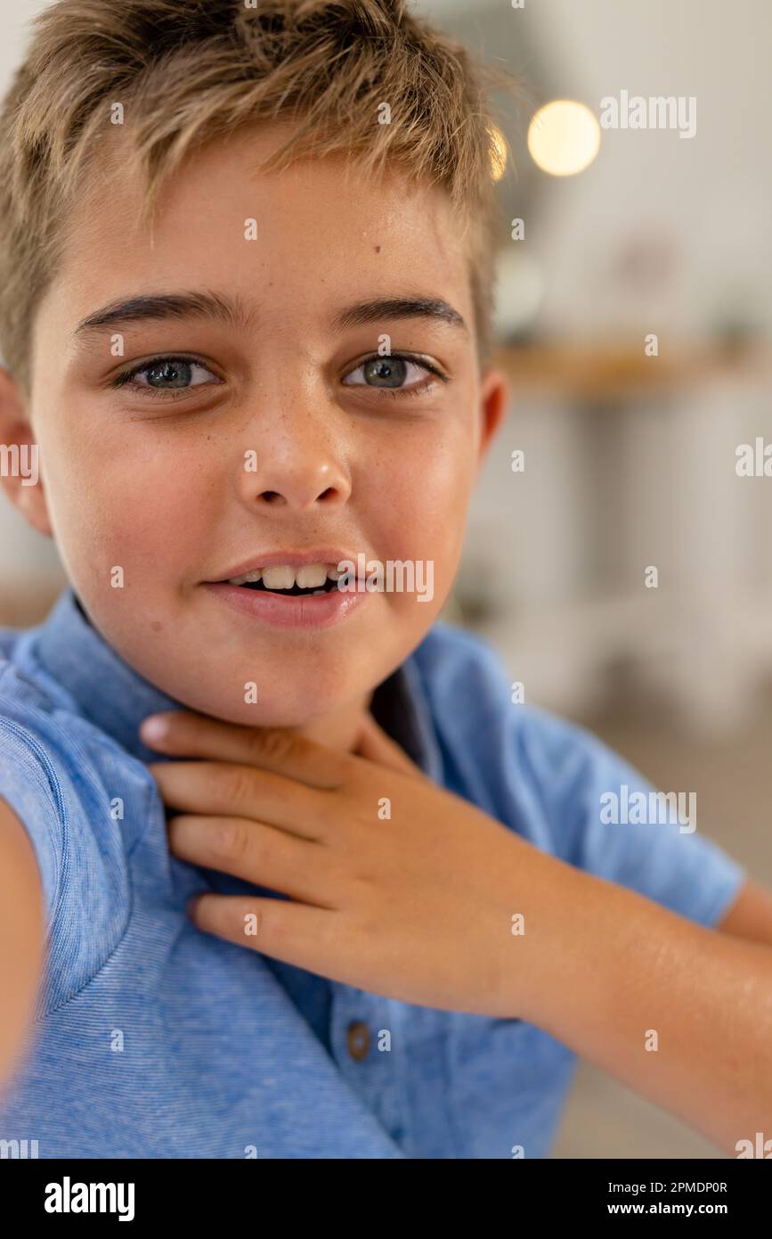 Closeup portrait of caucasian cute boy with gray eyes smiling and ...