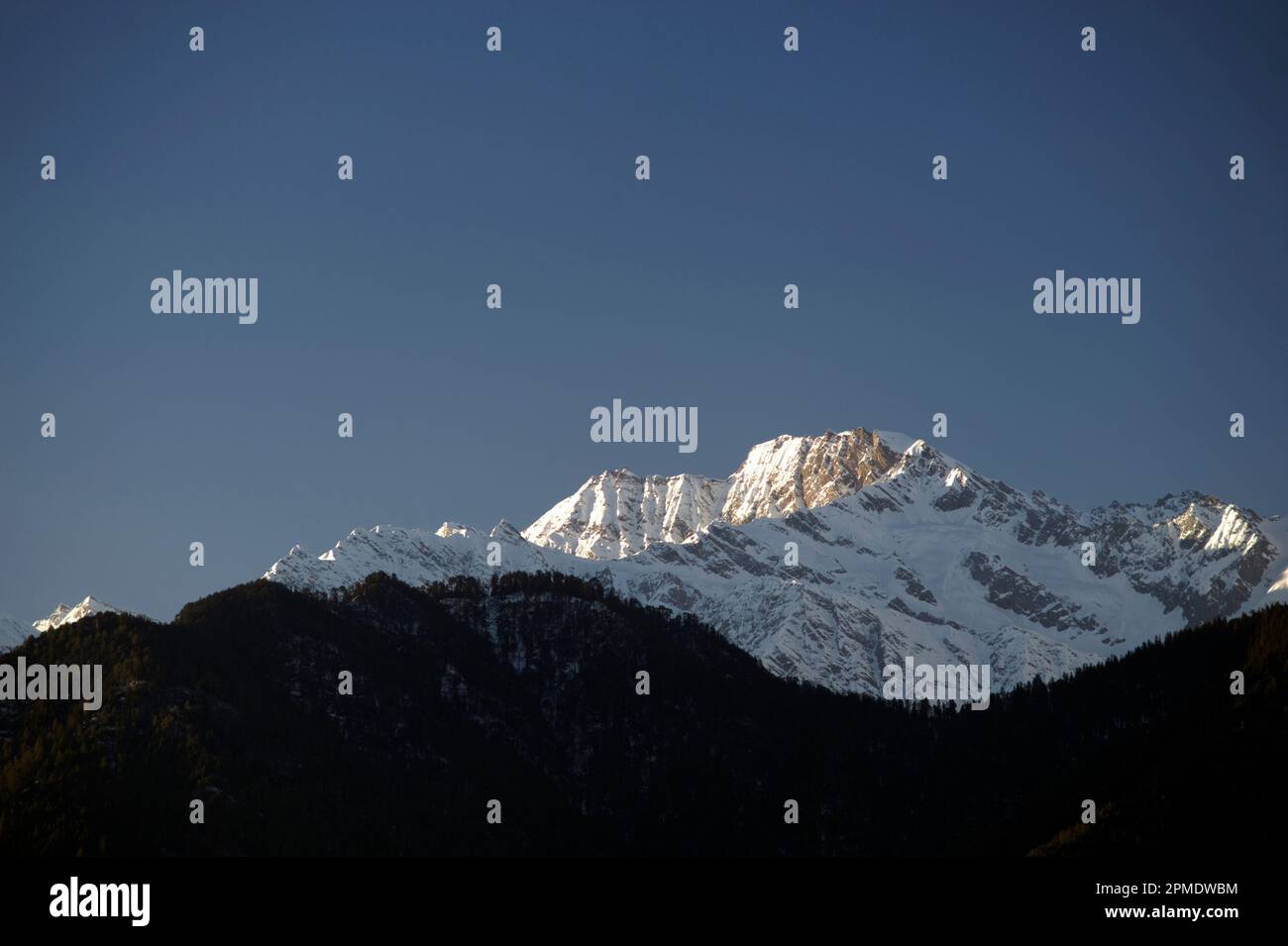 View of a Himalayas snow covered peaks from Sarahan of state Himachal ...